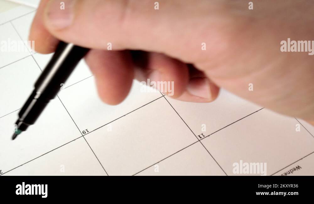 Sign the day in the calendar with a pen, draw a tick Stock Video ...