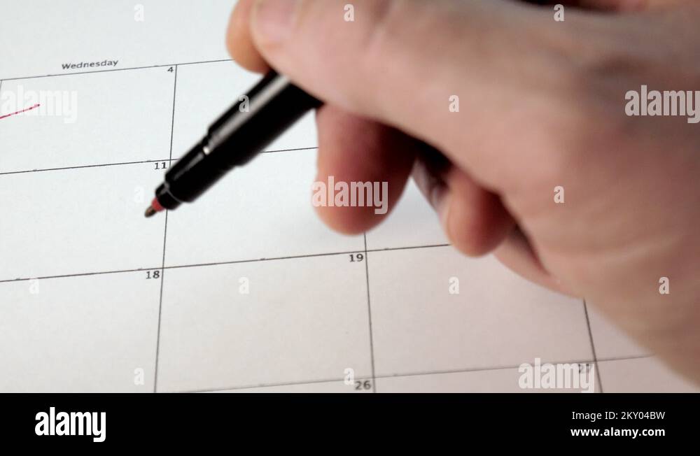 Sign the day in the calendar with a pen, draw a good bad day Stock ...