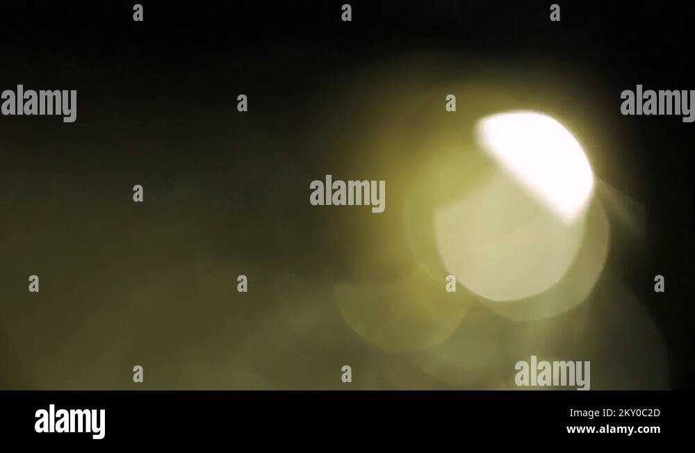 Rotating warm light in the dark. Creative motion transition, lens flare ...