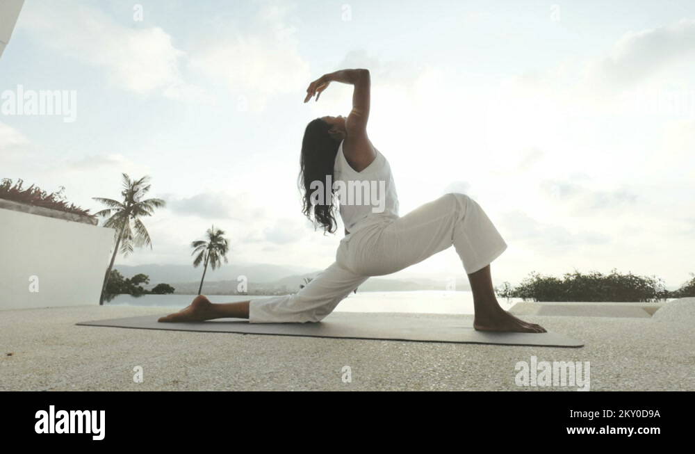 Woman practising yoga pose Parshva Upavistha Konasana. Healthy ...