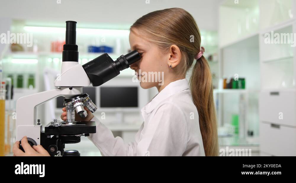 Child Using Microscope in School Chemistry Lab, Student Studying ...