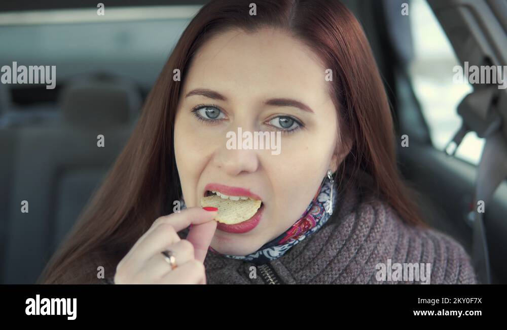 Woman eating chips Stock Videos & Footage - HD and 4K Video Clips - Alamy