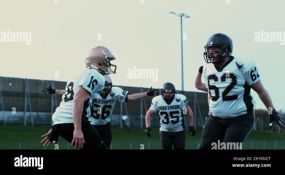 Super slow motion American football players in stadium, 4K shot on ...