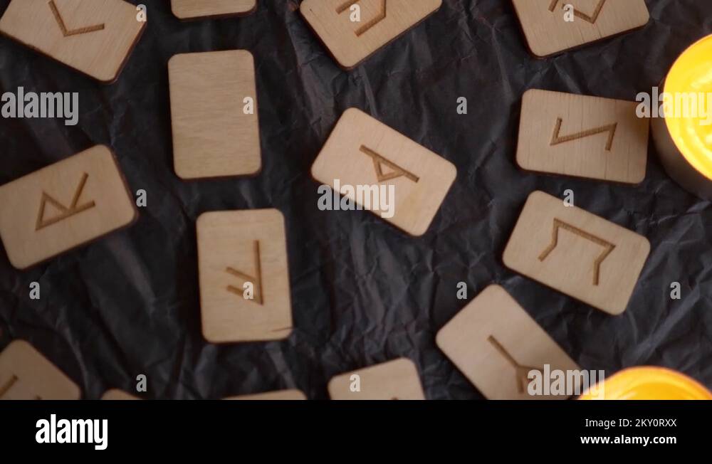 Wooden rune wheel. runic layout and candles, 4k, slow-motion shooting ...