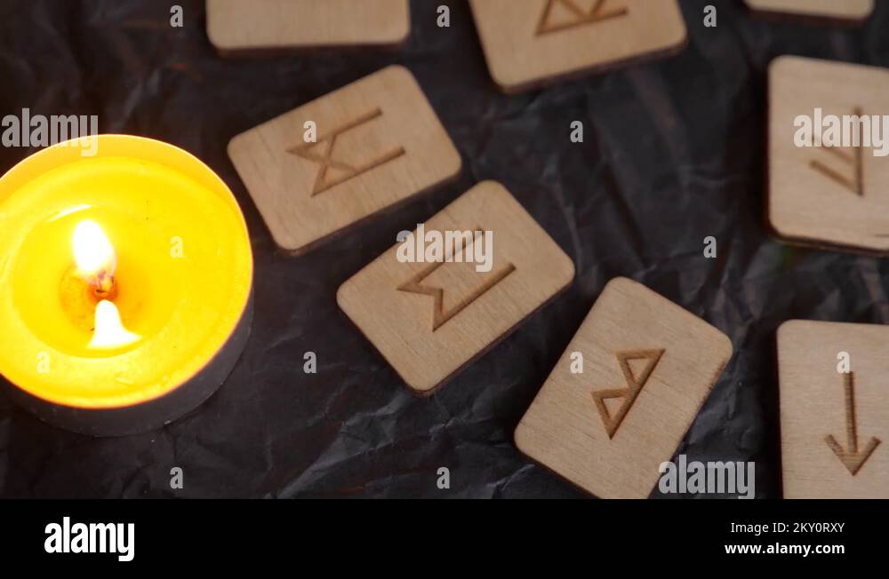 Wooden rune wheel. runic layout and candles, 4k, slow-motion shooting ...