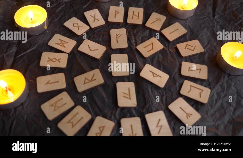 Wooden rune wheel. runic layout and candles, 4k, slow-motion shooting ...