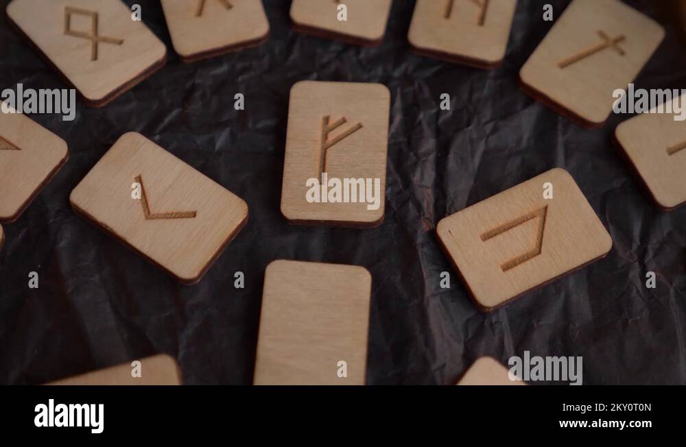 Wooden rune wheel. runic layout and candles, 4k, slow-motion shooting ...