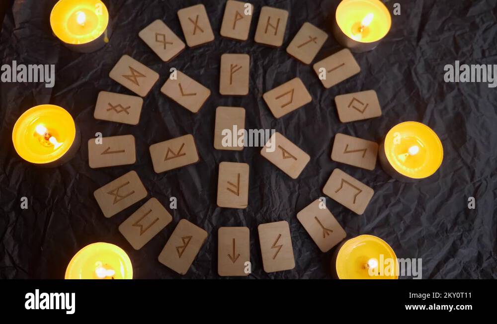 Wooden rune wheel. runic layout and candles, 4k, slow-motion shooting ...