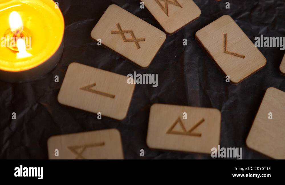 Wooden rune wheel. runic layout and candles, 4k, slow-motion shooting ...