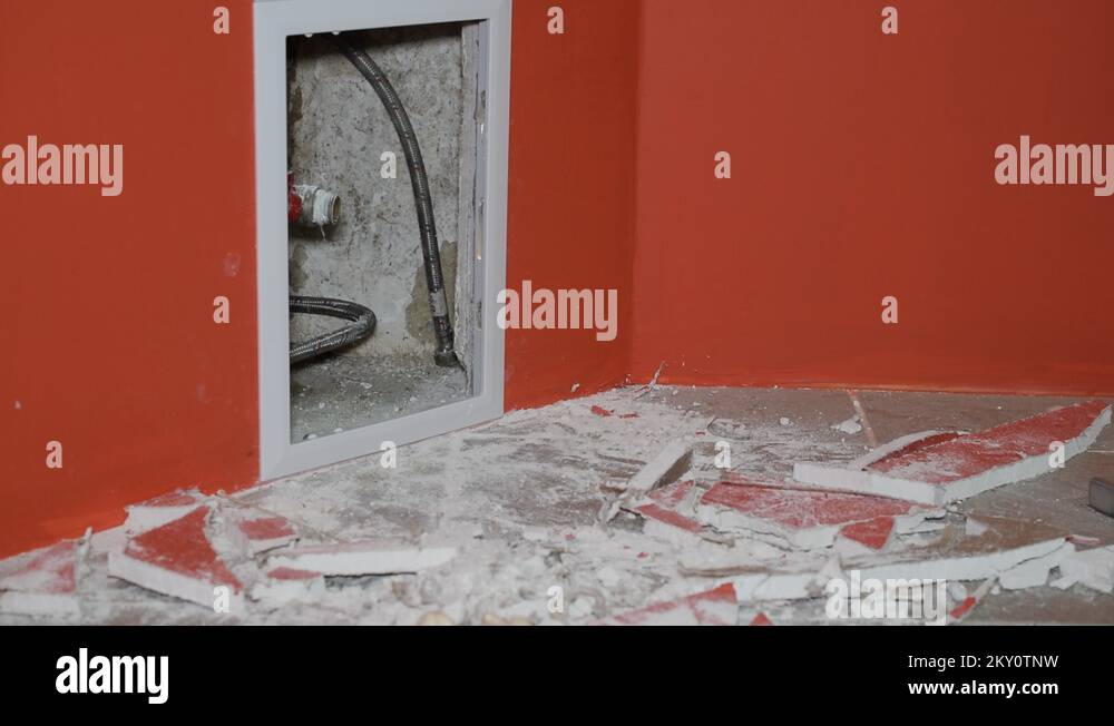 Installing plastic inspection window in a wall Stock Video Footage - Alamy