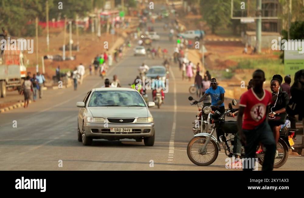 African busy Crowd of people walking and driving in main street ...