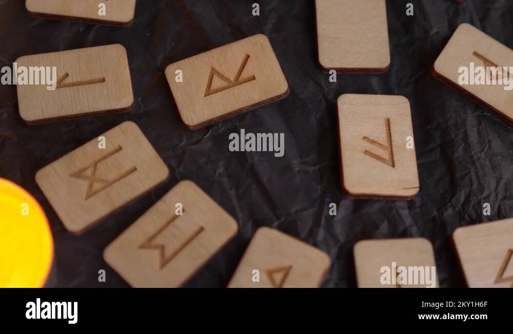 Wooden rune wheel. runic layout and candles, 4k, slow-motion shooting ...