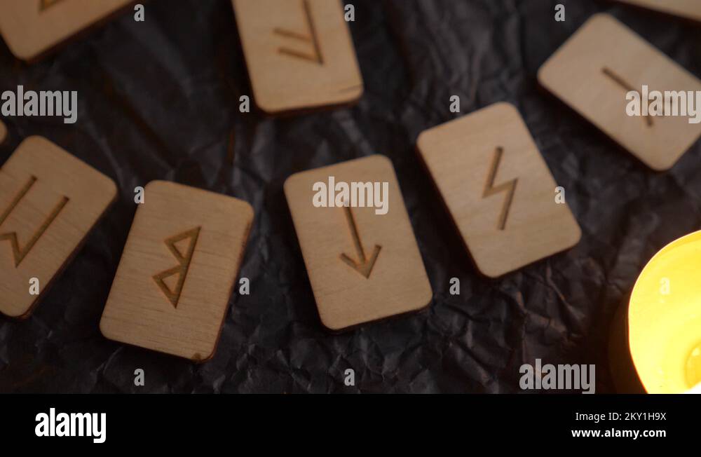 Wooden rune wheel. runic layout and candles, 4k, slow-motion shooting ...