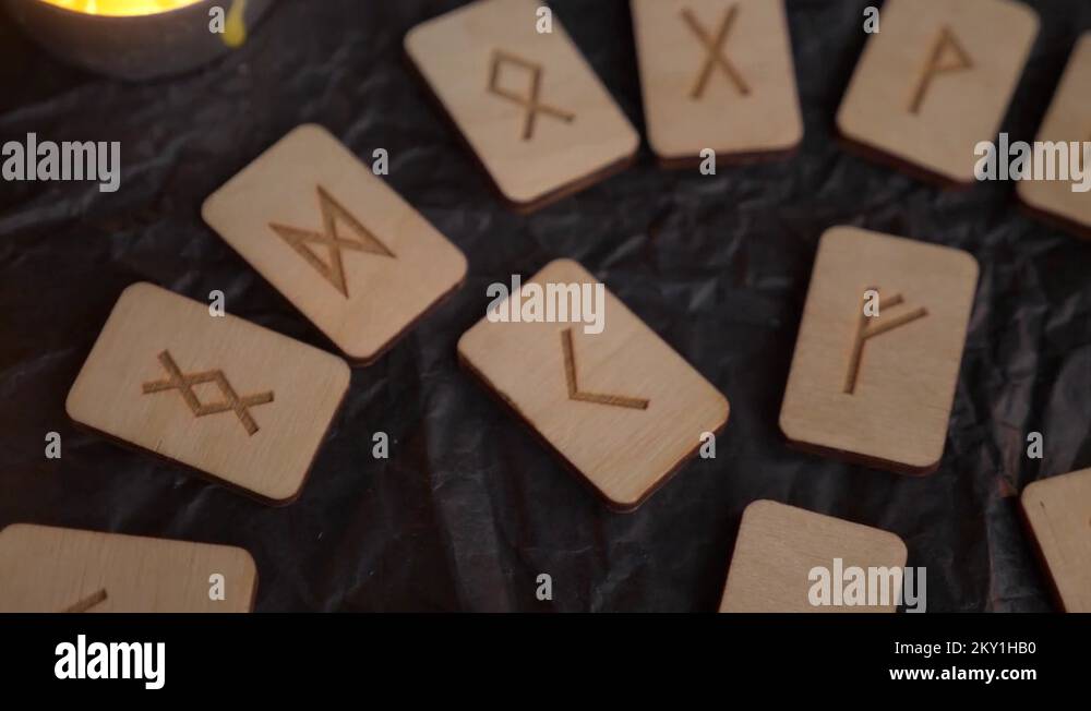 Wooden rune wheel. runic layout and candles, 4k, slow-motion shooting ...