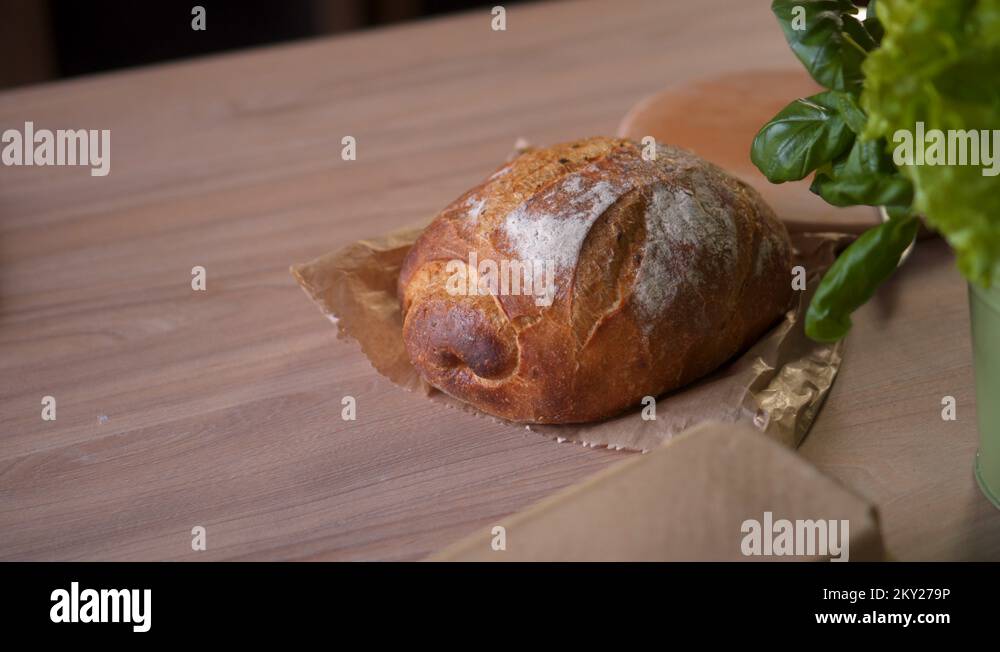 father cutting bread and giving one slice to his son Stock Video ...