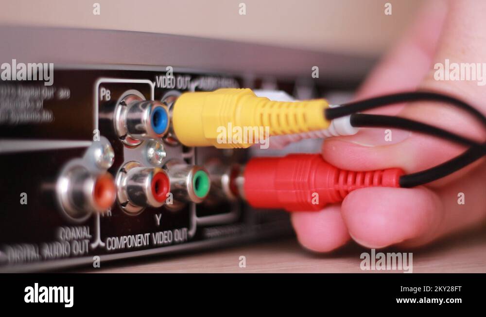 Inserting cables into electronic device Stock Video Footage - Alamy