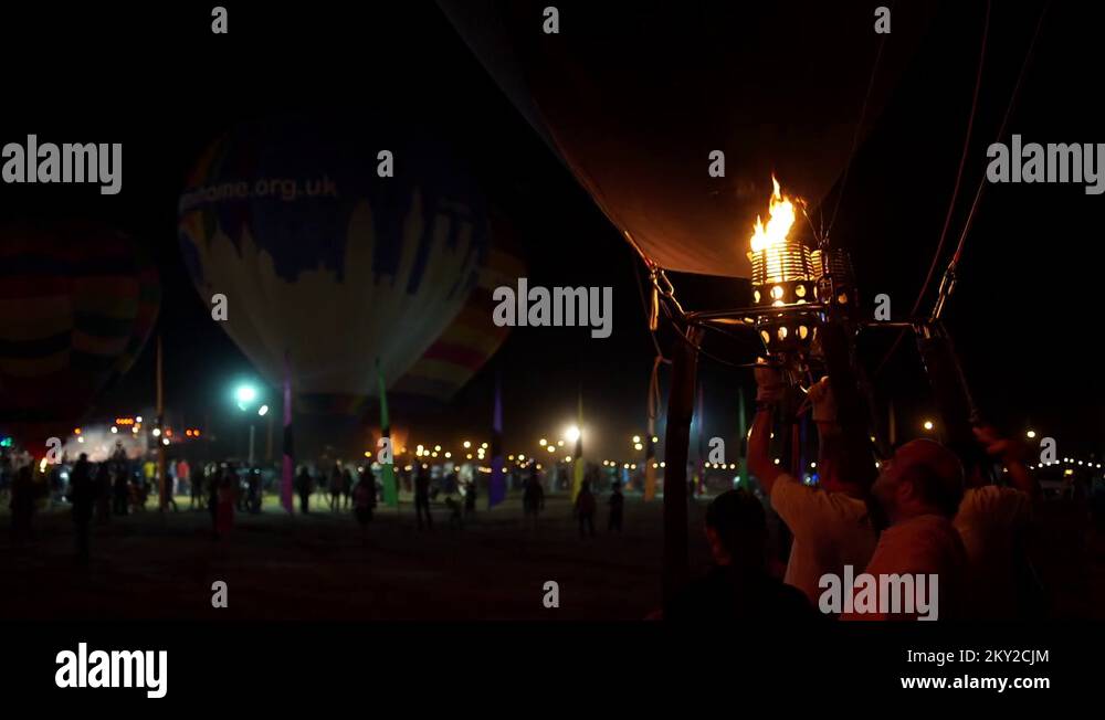 CHIANG MAI - CIRCA 2018: A balloon crew inflates the envelope of their ...
