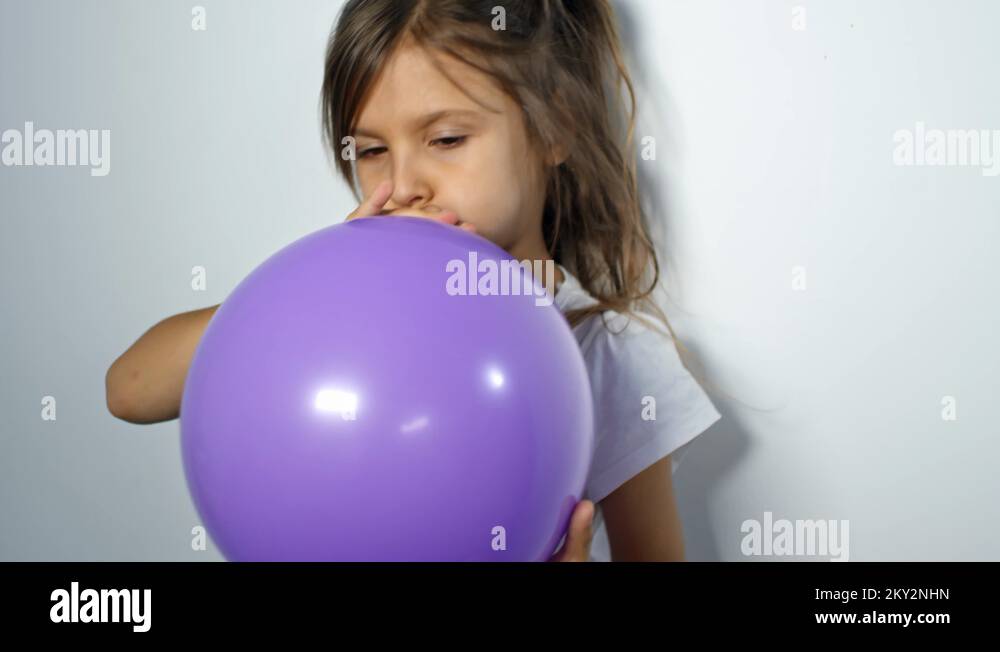 Girl blowing up balloon at party Stock Videos & Footage - HD and 4K ...