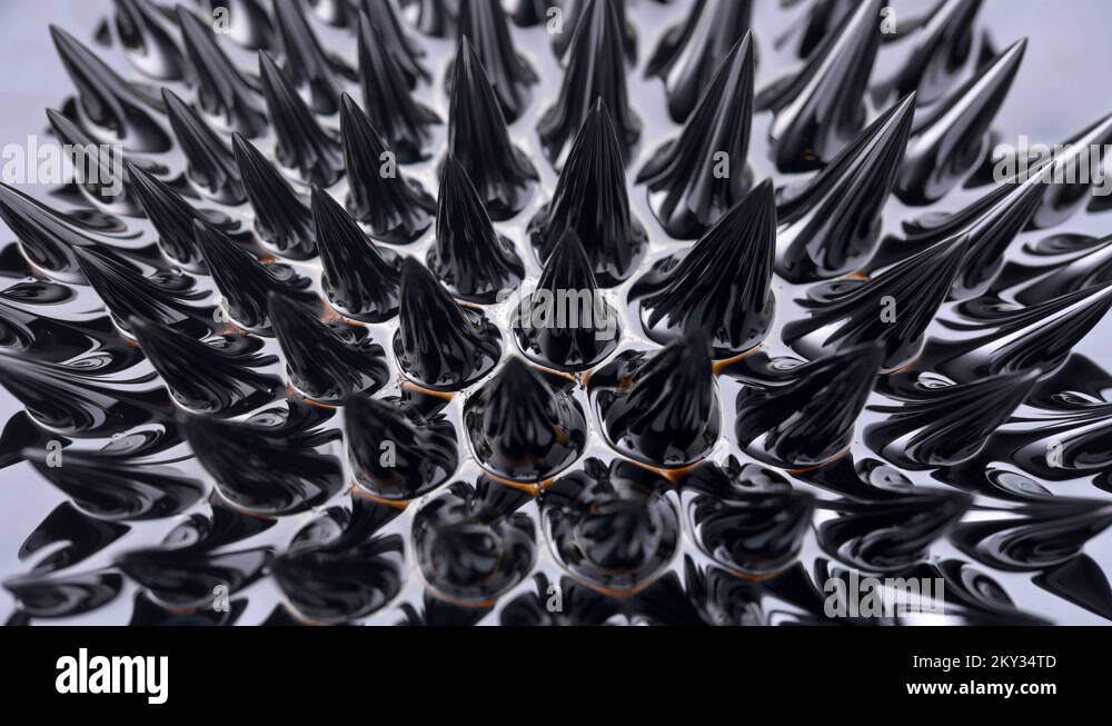 Ferromagnetic fluid creates amazing drawings in a magnetic field Stock ...