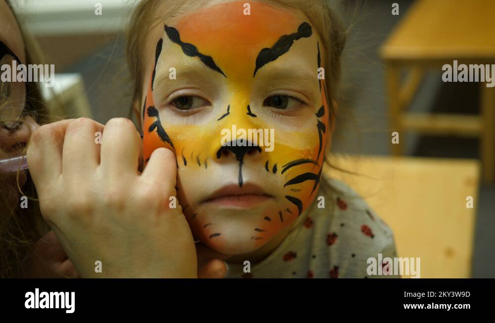 Body art painting face of cute little girl on birthday theme party as a ...