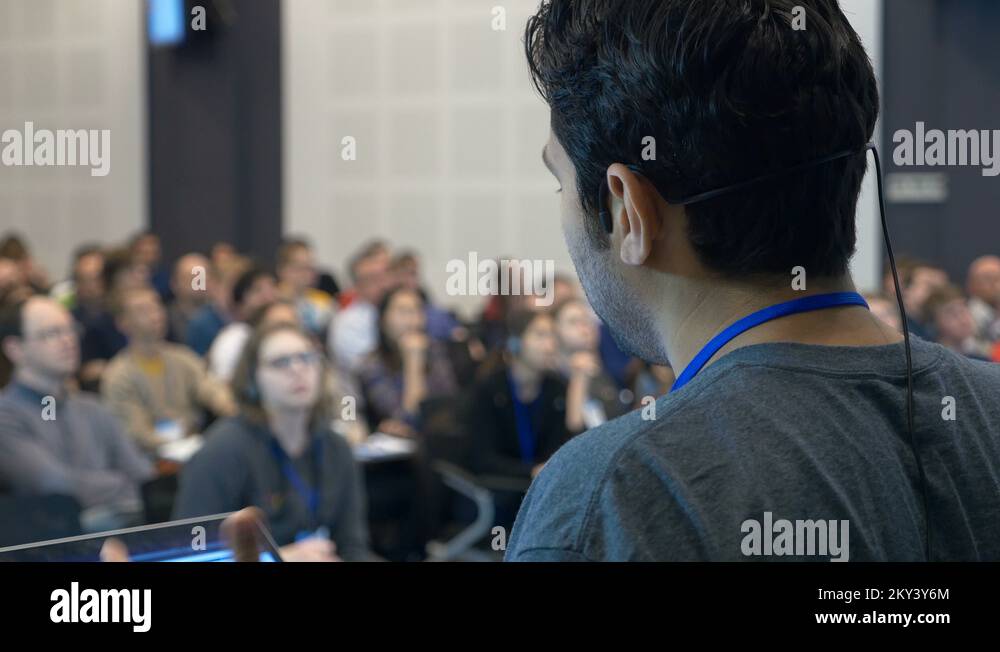 Back view: speech of man with students at university lecture in ...