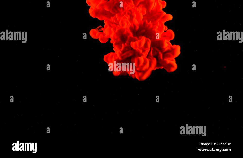 Red and blue ink in water shooting with high speed camera. Bloody paint ...