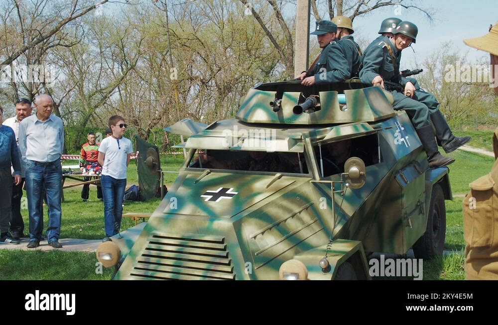 German soldiers of the Hitlerite army. German armored car of World War ...