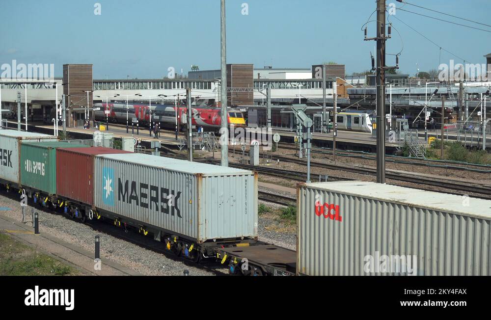 Freight and passenger railway trains at the station in the city of ...
