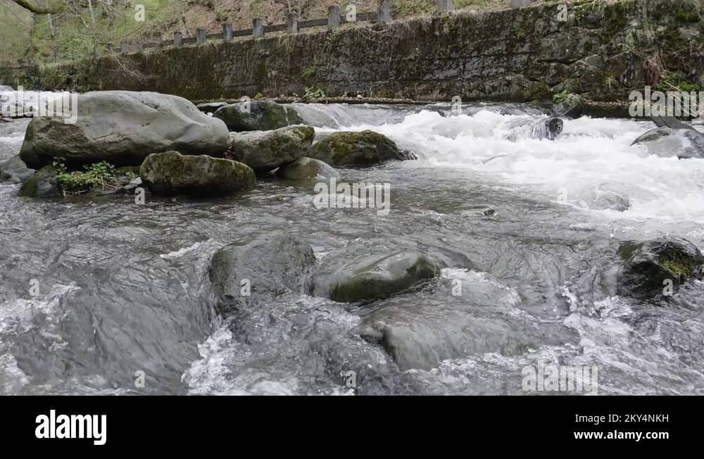Mountain river finding its way thru big rocks Stock Video Footage - Alamy