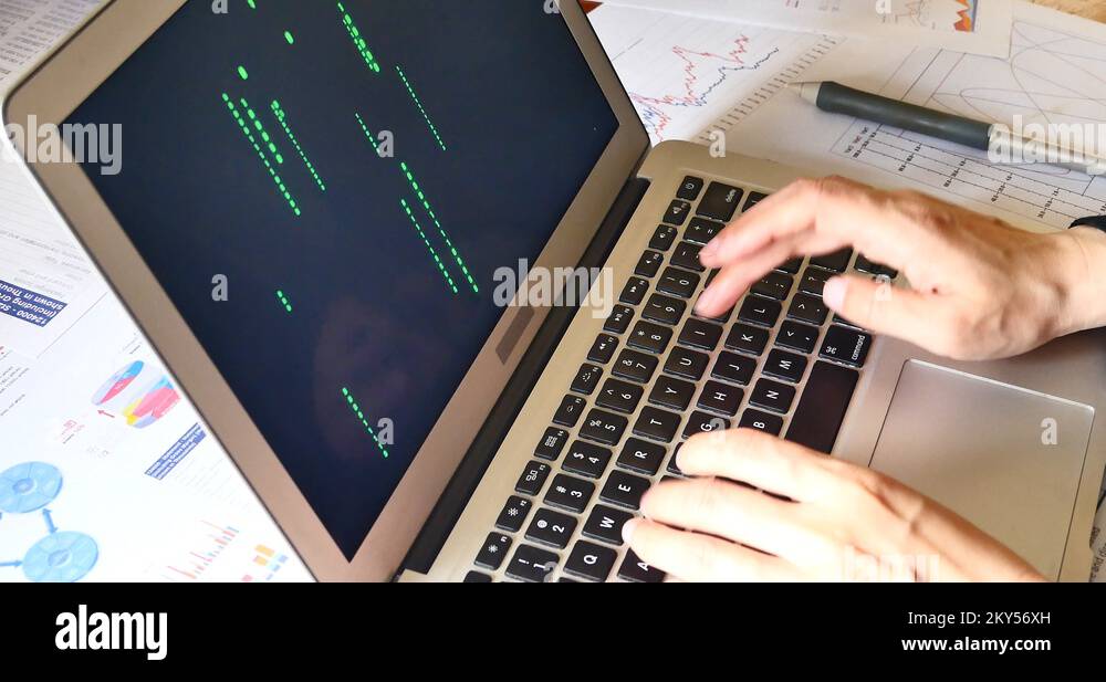 4k people operating computer,The Matrix style binary code on laptop ...