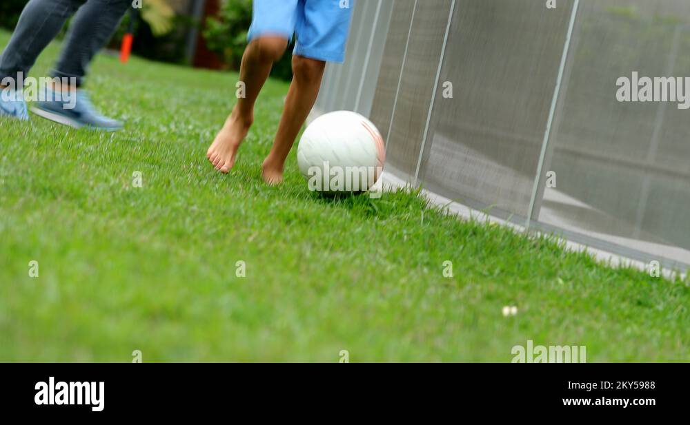 Children playing with soccer ball in 4K. Kids running after football ...