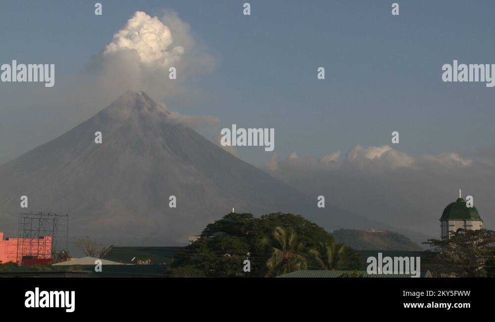 Mayon Volcano Erupts And Dominates Skyline Over City Stock Video ...