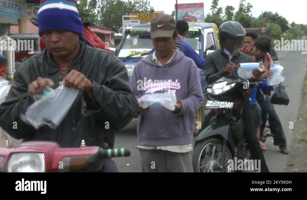 Local People Wear Face Masks During Volcanic Eruption Crisis In ...