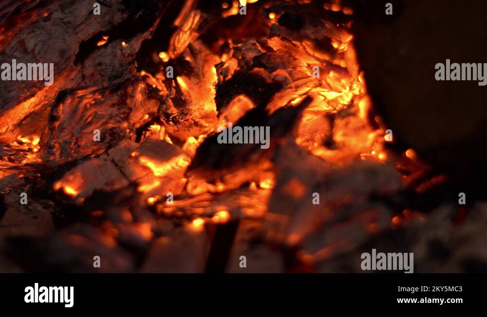 Slow Motion hot roaring fire and red coal in fireplace. Burning wood ...