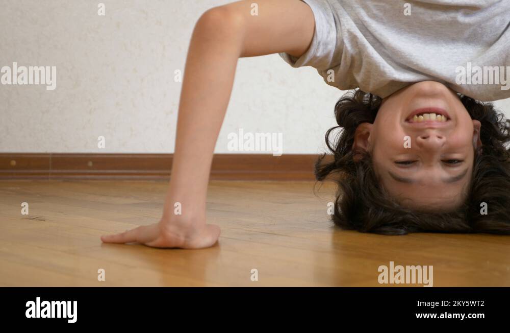 A funny teen boy does upside down pushups in the house. 4k, Slow motion Stock Video Footage - Alamy