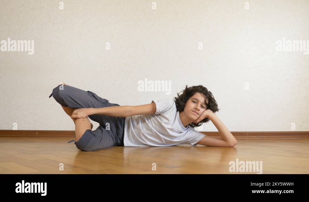 boy teenager, dancer break dance, trains in the dance hall. 4k, slow ...