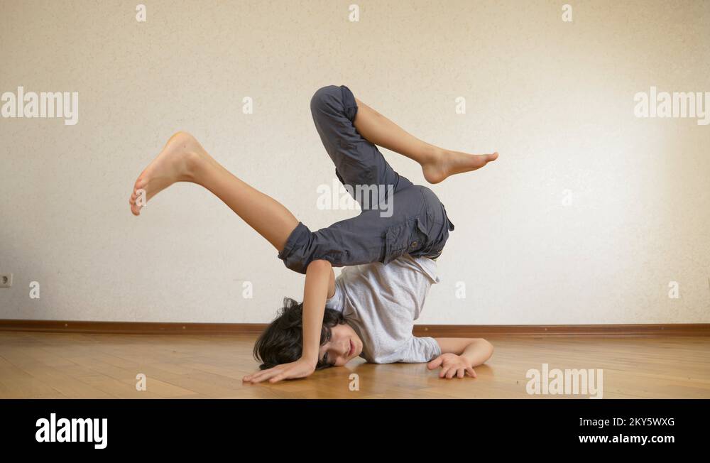 boy teenager, dancer break dance, trains in the dance hall. 4k, slow ...