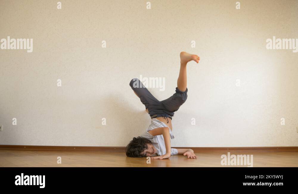 boy teenager, dancer break dance, trains in the dance hall. 4k, slow ...