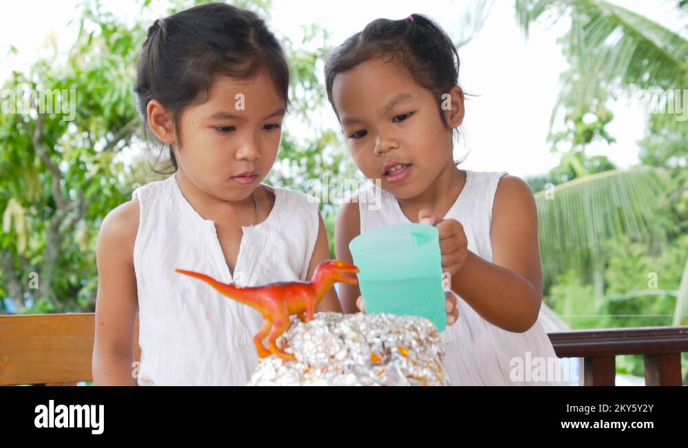 Two girls do volcano experiment at their house, slow motion in 50 fps ...