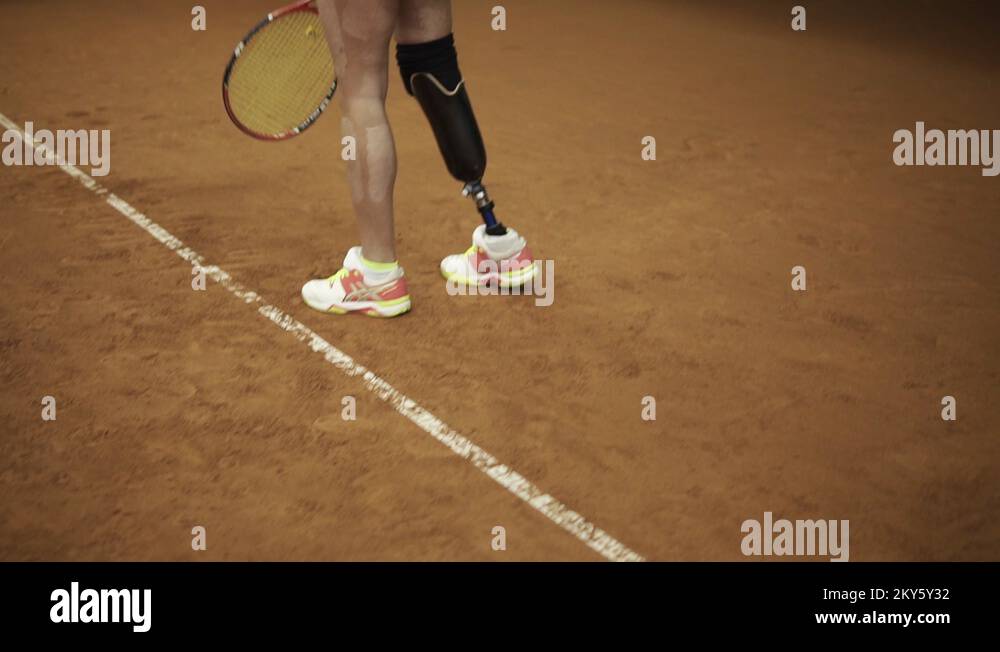 Gorgeous slow motion footage of a stunning tall woman serving the ball ...