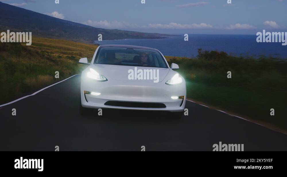 Tesla Model 3 Electric Car Driving at Sunset Stock Video Footage - Alamy