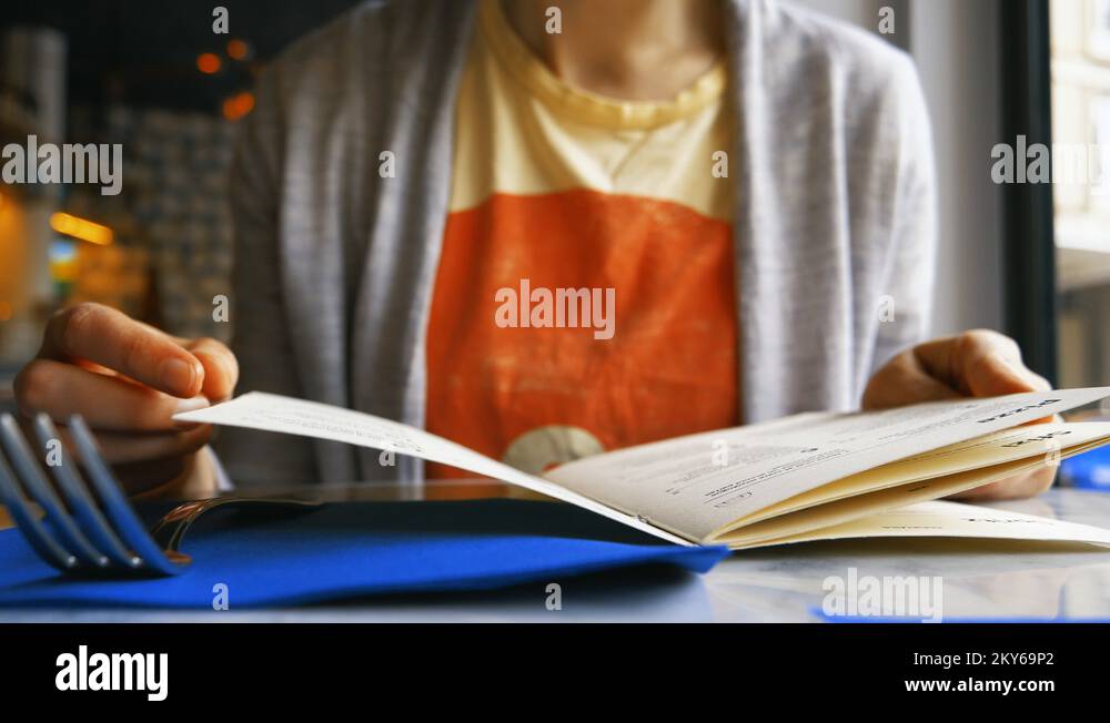 Woman ordering food in restaurant menu reading Stock Video Footage - Alamy