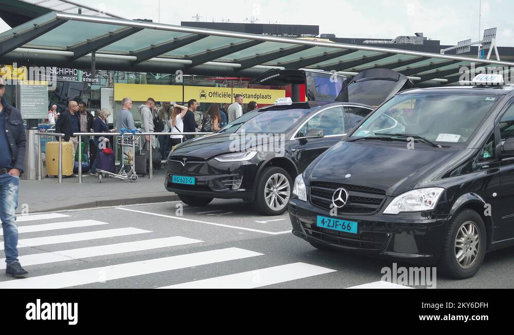 Tesla cars as taxi at Schiphol airport Stock Video Footage - Alamy