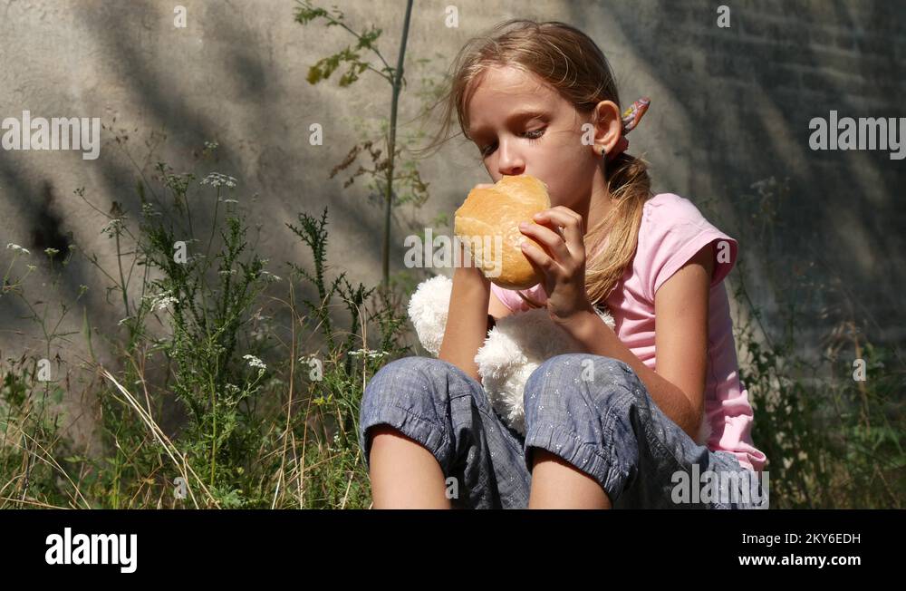 Poor child eating bread Stock Videos & Footage - HD and 4K Video Clips ...