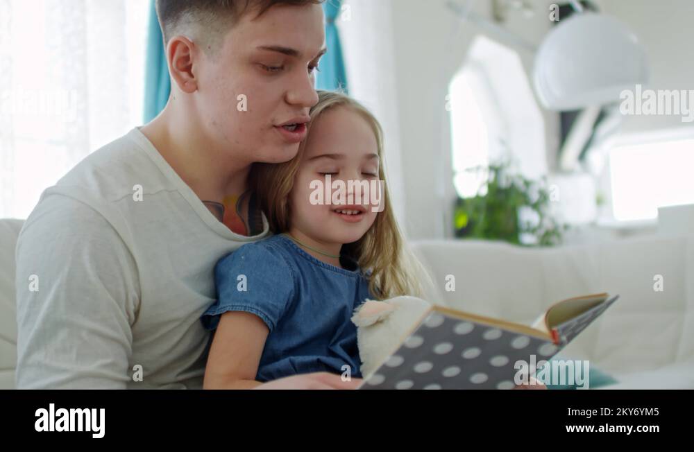 Father reading book Stock Videos & Footage - HD and 4K Video Clips - Alamy