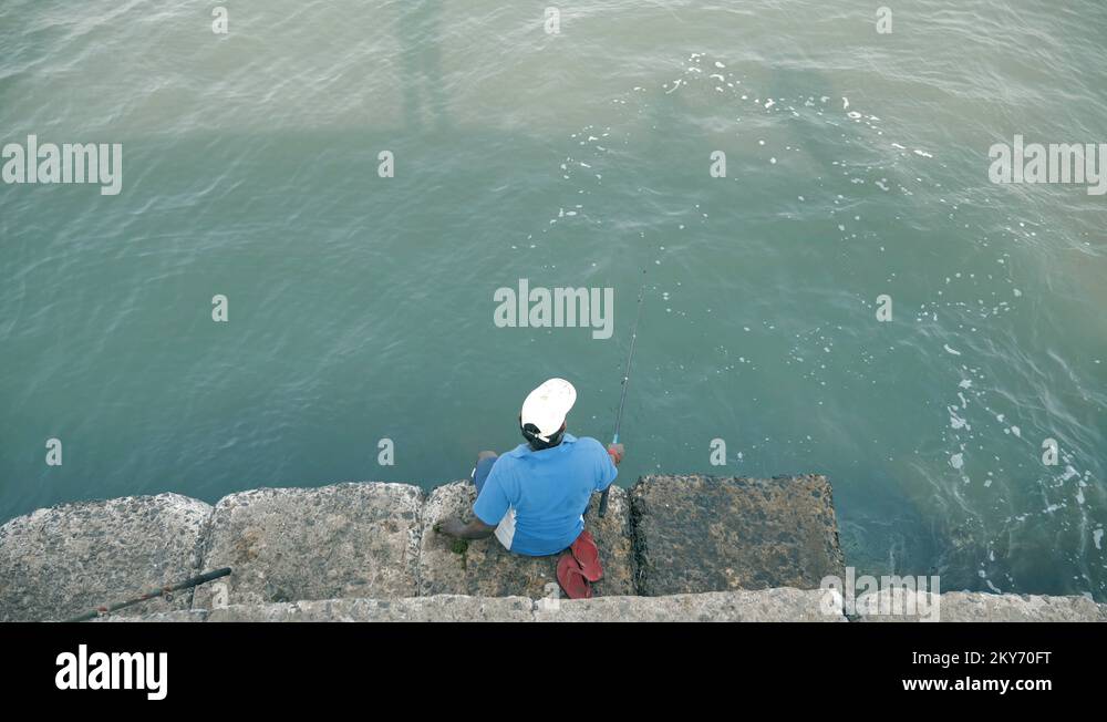 A local Indian fisherman fishing in the Arabian sea at the dock, india ...