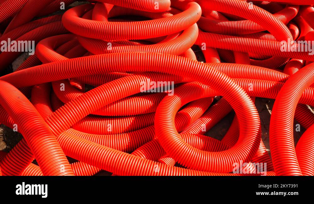 Industrial background. Plastic corrugated pipes, drainage in the roll ...