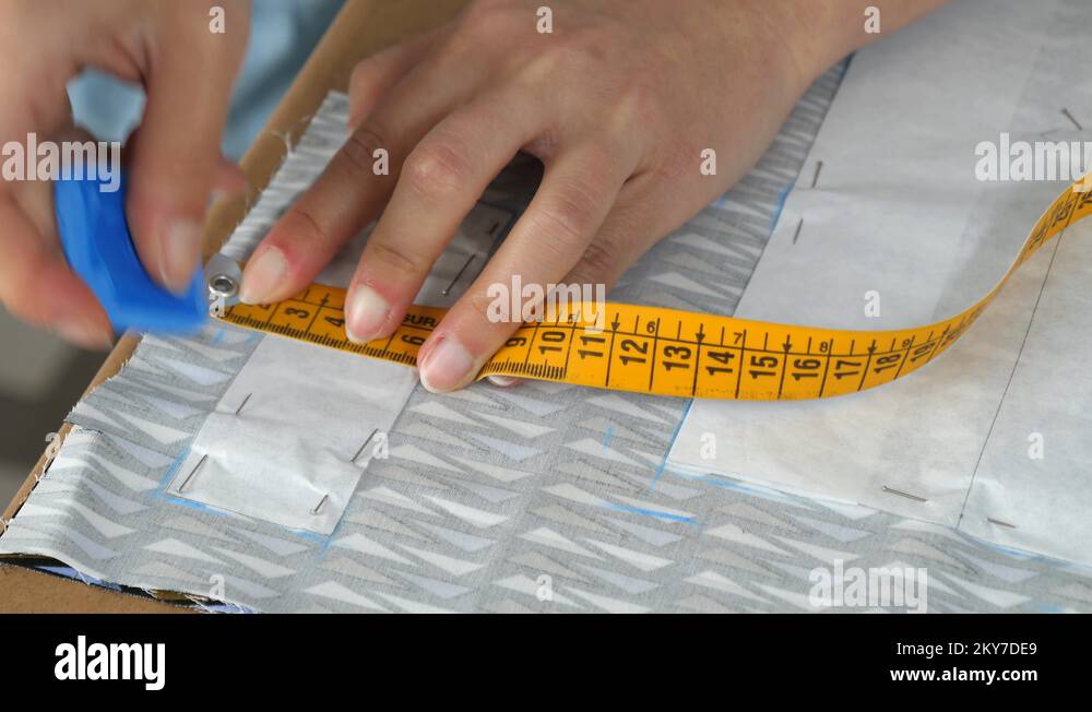 Female designer creates a template of the future dress, close up Stock ...