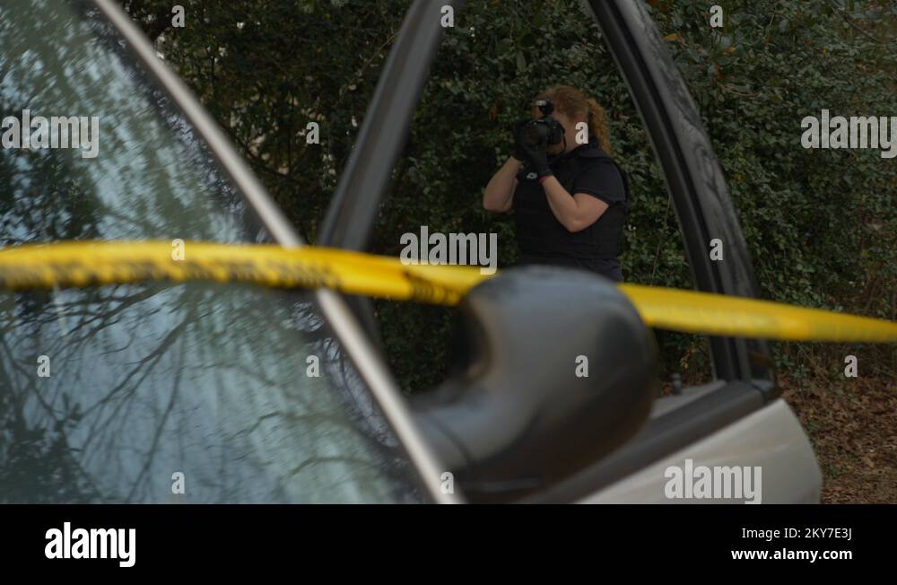 Crime scene investigator with camera Stock Video Footage - Alamy