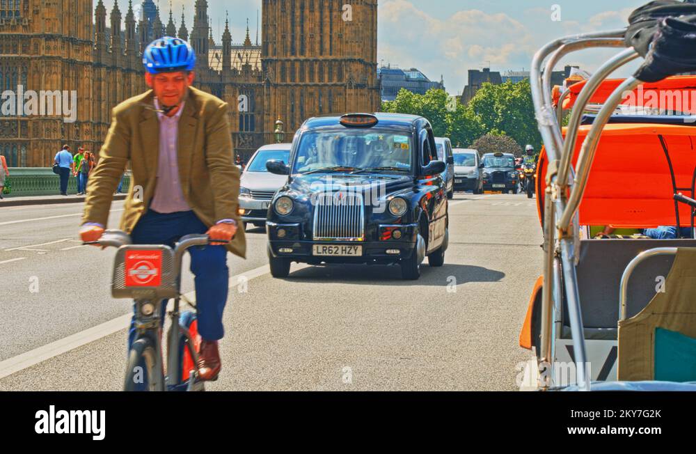 London Taxi Pass In Front Of Big Ben palace Stock Video Footage - Alamy